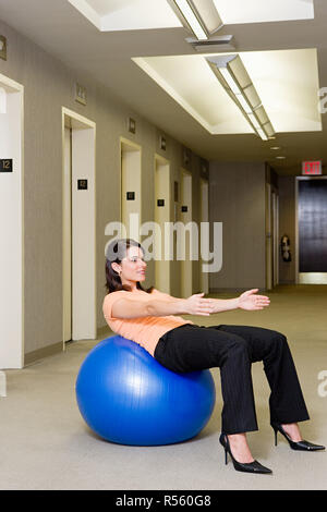 female office worker stretching to ease her painful back Stock Photo ...