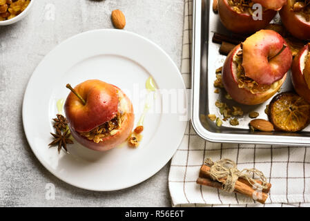 Appetizing baked apple with granola, cinnamon, nuts and honey. Healthy ...