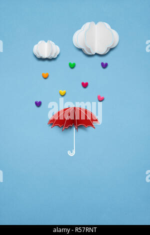 Creative valentines concept photo of cloud with hearts raining on white ...