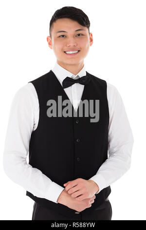 Portrait of glad positive smiling waiter with serving tray meeting ...