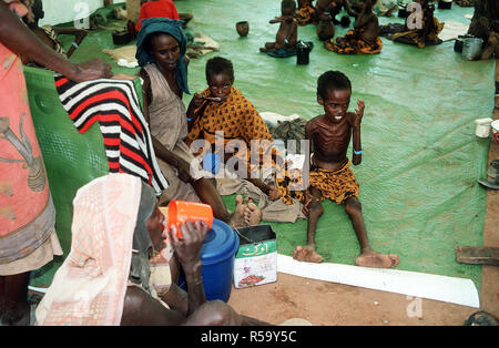 Somali refugees are fed at an aid station set up during Operation ...