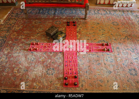 Chaupar/chopad is a cross and circle board game similar to pachisi ...