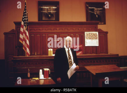 An official stands in the courtroom of the Atchison County Courthouse ...
