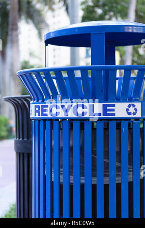 A big blue recycle garbage can showing the recycle logo for aluminum ...