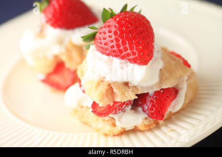 Small fresh strawberry shortcakes closeup Stock Photo - Alamy