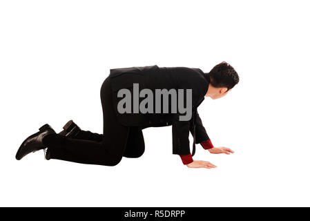 Asian business man crouching isolated over white background Stock Photo ...