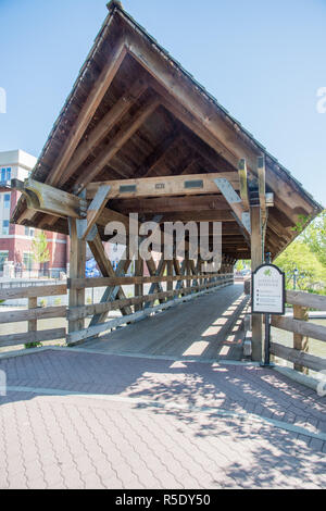 Naperville Riverwalk sign by a footpath and covered bridge Stock Photo ...