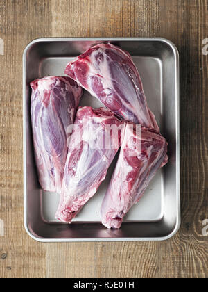 rustic uncooked lamb shank Stock Photo - Alamy