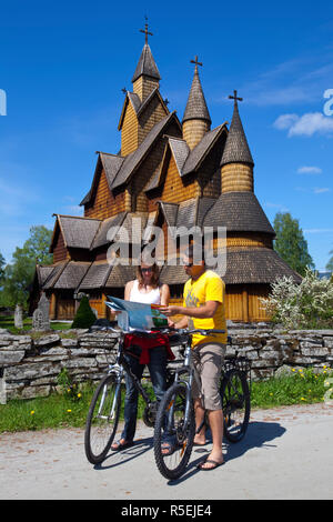 Tourists checking map beside Heddal Stave Church, Norway's largest ...