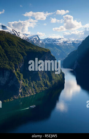 A car ferry navigates through the dramatic Geiranger Fjord, Geiranger ...
