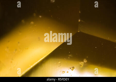 Yellow gem under the microscope Stock Photo - Alamy