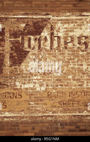 USA, Alabama, Decatur, faded wall advertsing sign Stock Photo - Alamy
