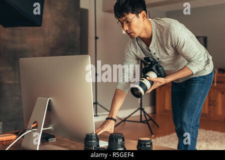 Photographer setting camera Stock Photo - Alamy