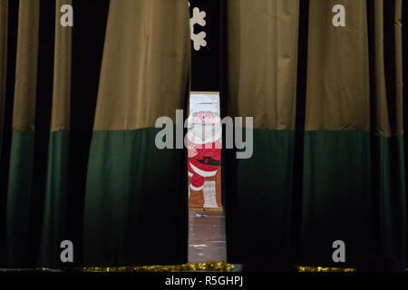 christmas recitation with open curtain and santa claus in the ...