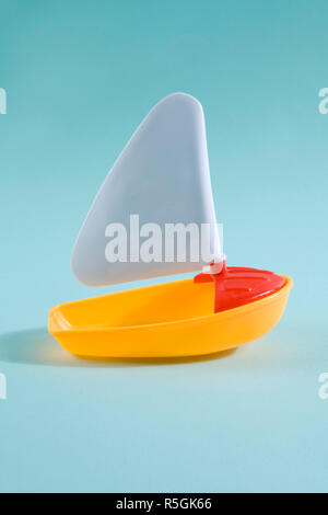 A boat toy lost at sea. Minimal Poetic metaphor still life photography ...