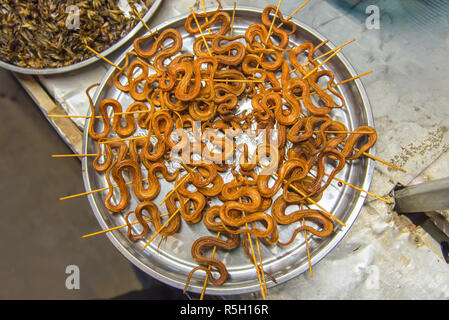 grilled snakes on sale for food market in China Stock Photo - Alamy