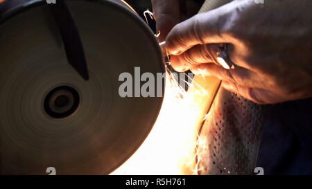 the shoemaker's sharpening metal taps on the machine Stock Photo - Alamy
