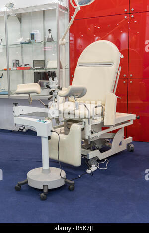 Gynecological cabinet with chair and other medical equipment in modern ...