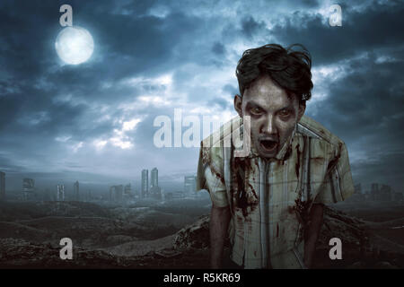 Creepy asian zombie man with angry face over dark sky background Stock ...