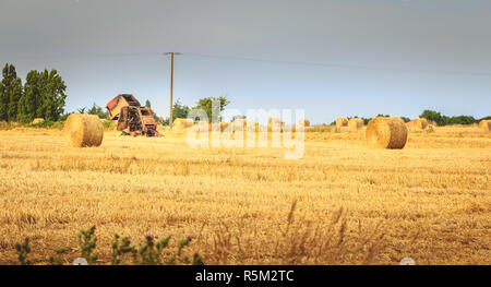 Remains of a round baler after a fire Stock Photo - Alamy