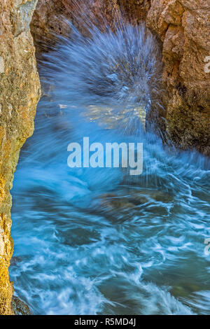 Waves crashing on rocks off the coast of The Garrison, St Mary's, Isles ...