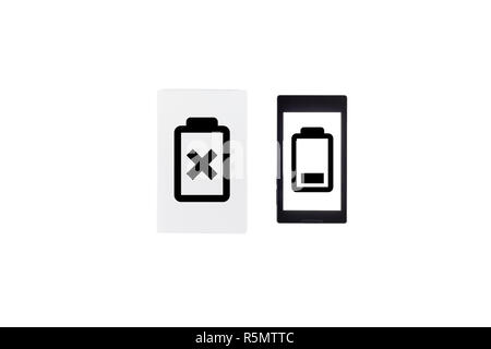 Comparison of a tablet and a book isolated on white. Battery life ...