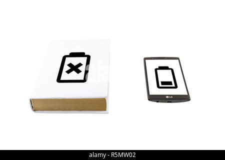 Comparison of a smartphone and a book isolated on white. Battery life ...