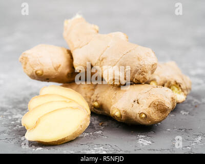 Fresh ginger root. Gray kitchen table background, top view Stock Photo ...