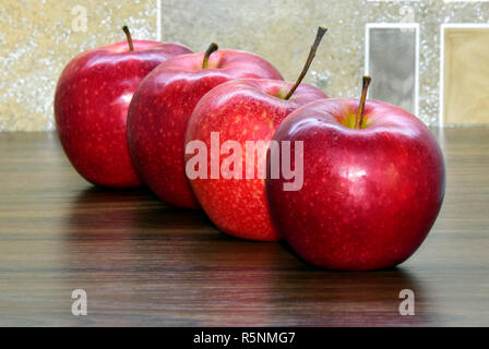 Red and yellow apples placed in a container box and with copy space ...