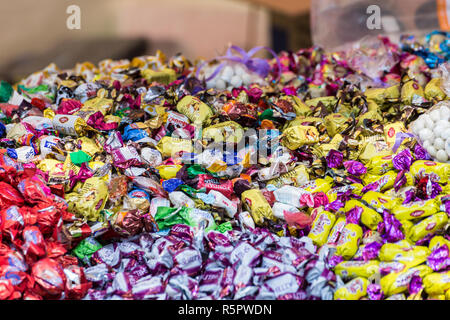 Pile of multi-colored packaged candy Stock Photo - Alamy