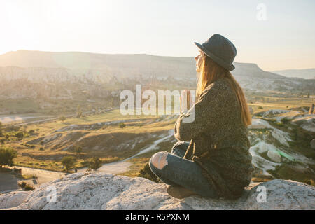 A girl practices yoga or meditation or searching for a soul against the ...