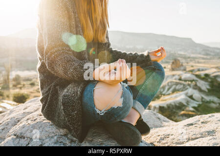 A girl practices yoga or meditation or searching for a soul against the ...