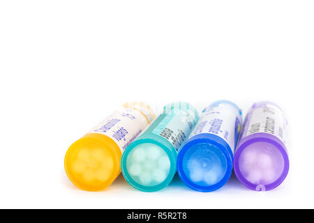 Homeopathic medicine in plastic tubes in four different color Stock ...