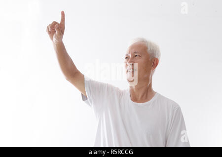 Photo portrait of grandpa pointing finger to side holding phone in one ...