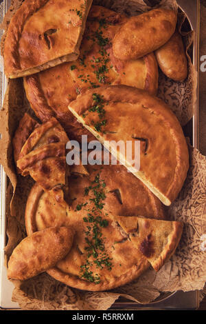 Composition with delicious meat mini pies on table Stock Photo - Alamy
