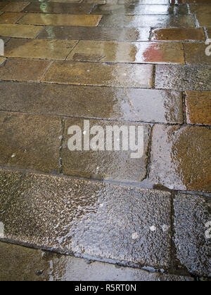 Wet pavements after rain in pedestrianised High Street are of town ...