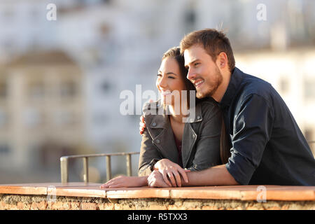 Woman contemplating views from apartment balcony Stock Photo - Alamy