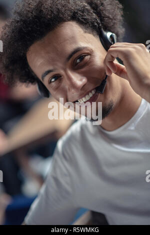 Laughing african american hipster software developer at computer at ...