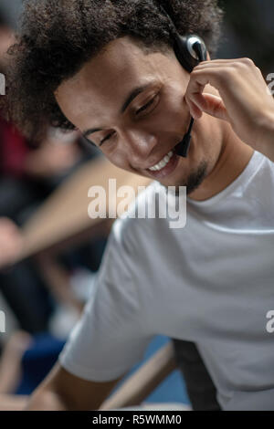 Laughing african american hipster software developer at computer at ...
