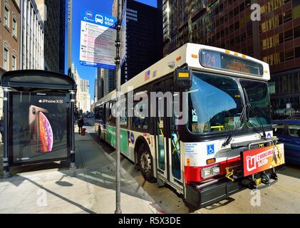 A CTA bus stop in downtown Chicago. The bus stop is built into the ...