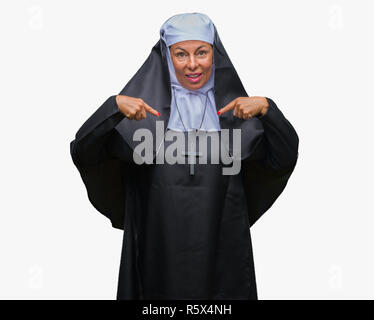 People pointing at senior woman with Holy Bible on green background ...