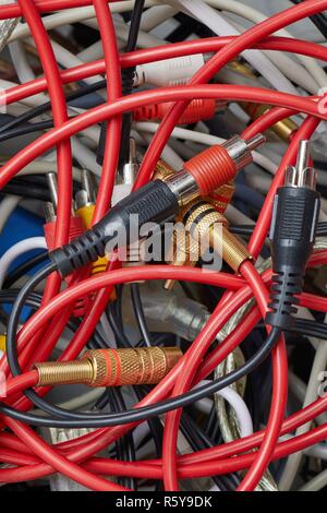 Tangled cables in the extension cord. Messy cables. Cables tangled on ...