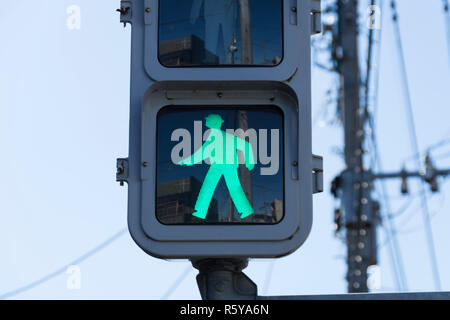 Green man go walk traffic light sign England UK Stock Photo - Alamy