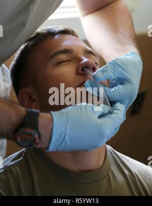 A U.S. Army soldier receives a nasopharyngeal airway during the CBRNE ...