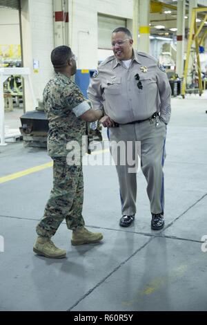 (Left) Colonel Sekou Karega, commanding officer, Marine Corps Logistics ...
