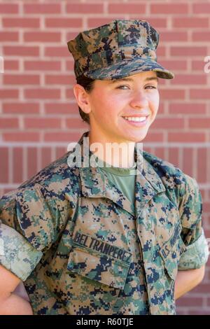 U.S. Marine Corps Pfc. Maria Daume, center, a mortarman assigned to ...