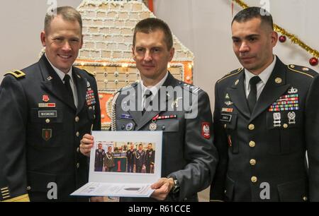 Maj. Gen. Todd Wasmund, U.S. Army Southern European Task Force, Africa commander, pins a The ...