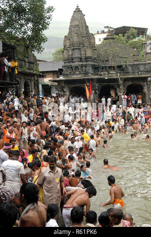 Hindu devotees take a holy dip as they perform rituals on the banks of ...