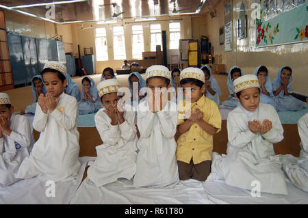 School children praying Namaz before their classes at a School at ...