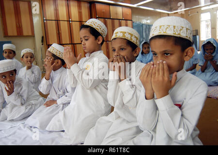 Muslim kids praying at school Stock Photo - Alamy